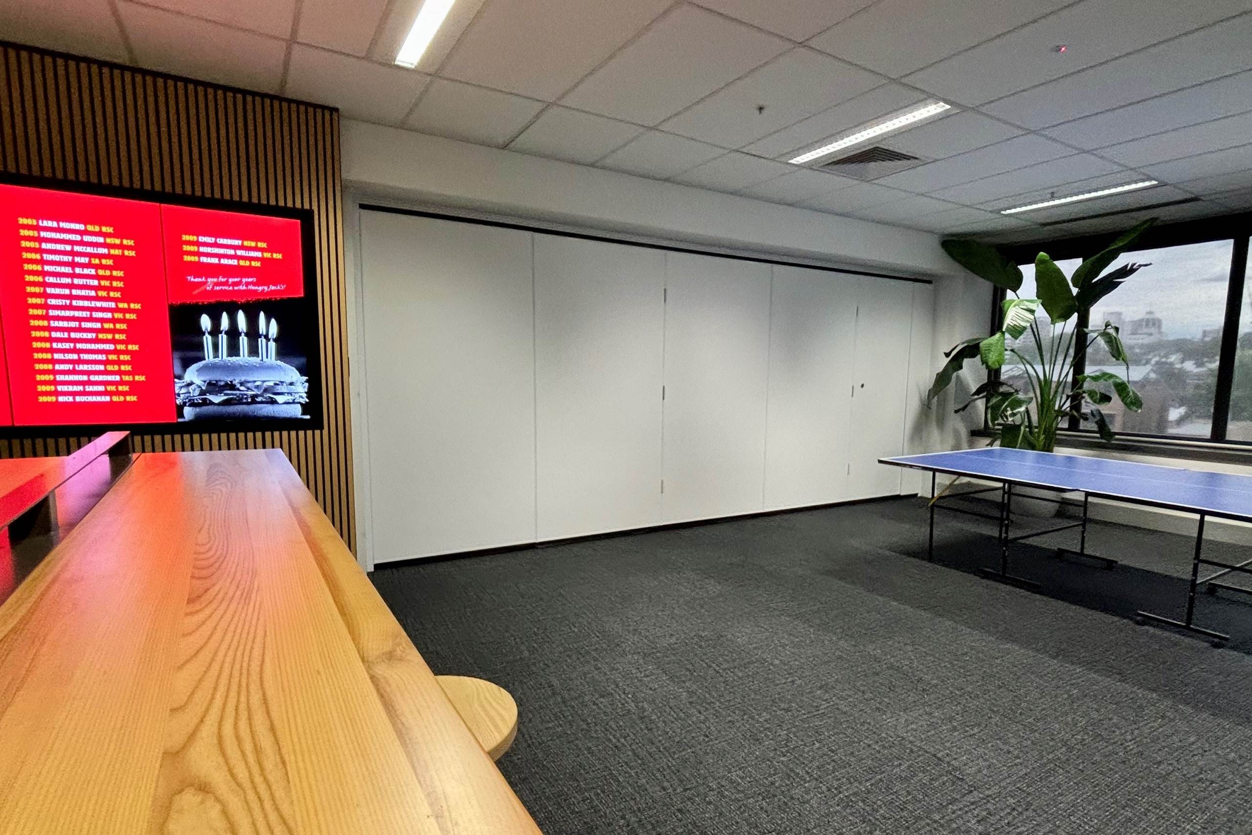 Bildspec acoustic operable wall separates training space from breakout ...