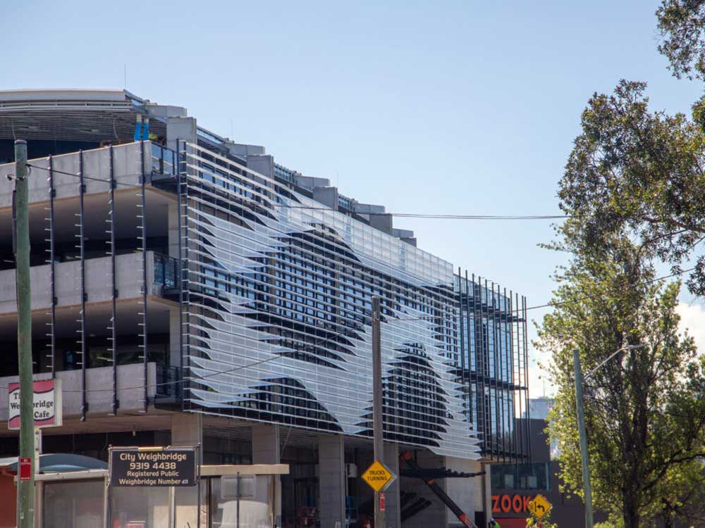 Twisted fin screening provides solar shading on Bourke Rd building ...