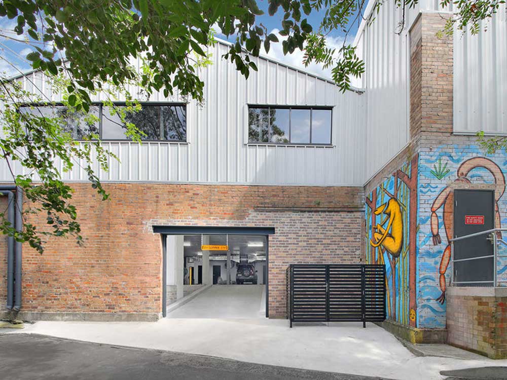 New office hub repurposed from old factory gets a sleek edge with ...