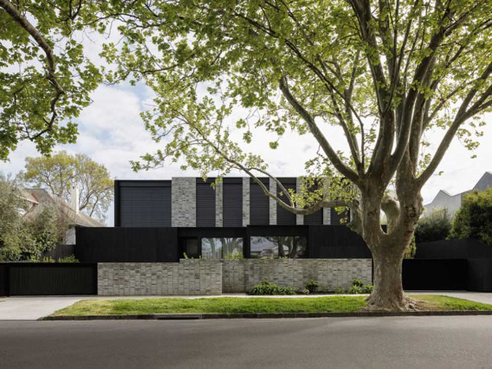Brick and charred timber palette adds grandeur to side-by-side ...