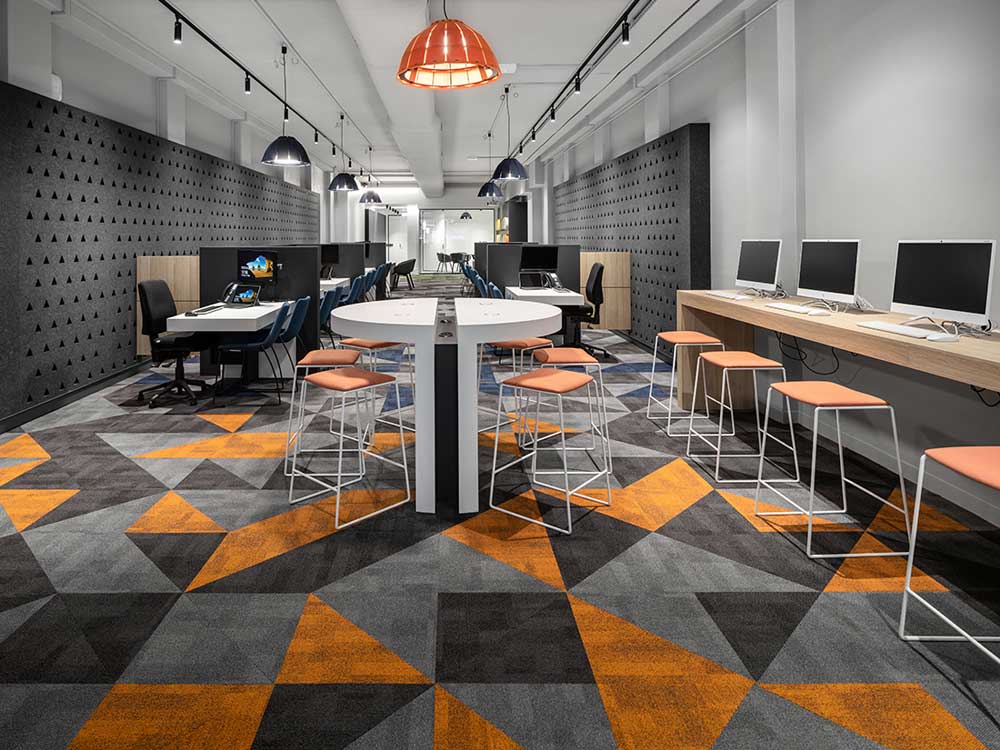 Signature carpet tiles support wayfinding and zoning at tertiary ...