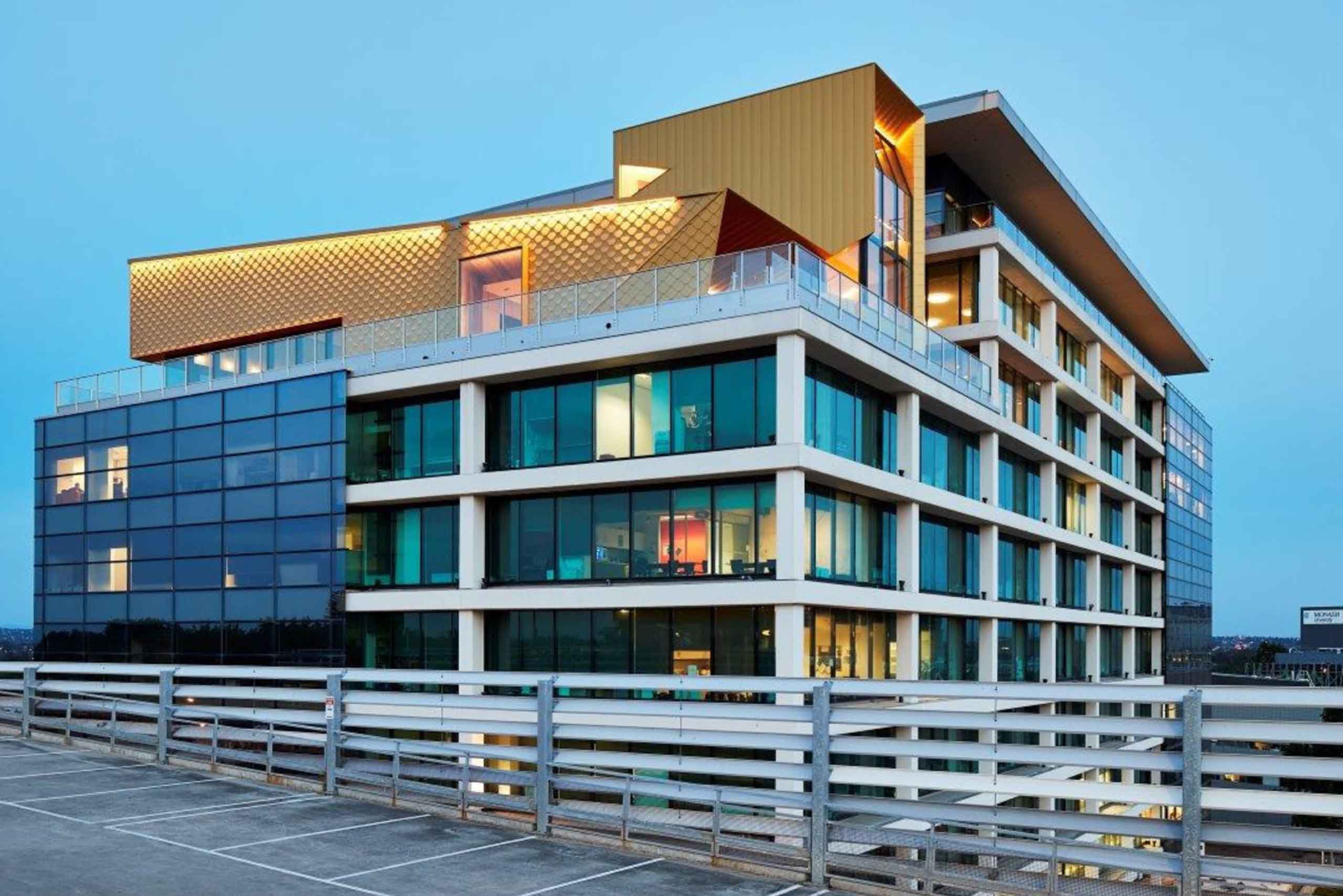 Custom gold VMZINC panels used for cladding and roofing at Monash ...