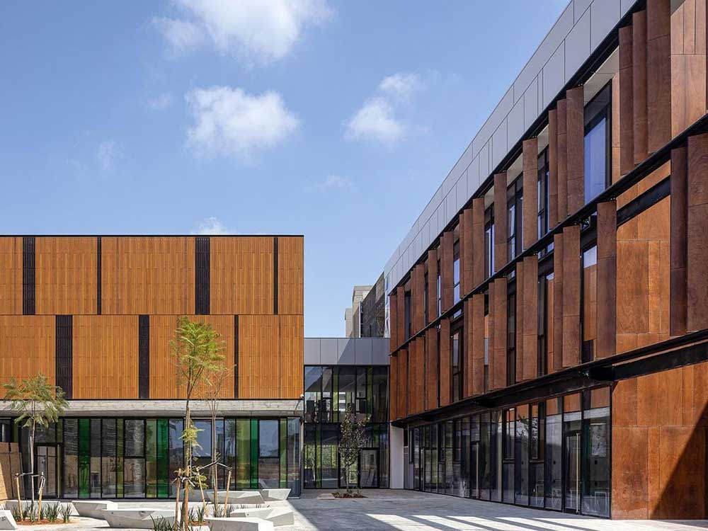 Prodema natural wood panels add warmth to school facade | Architecture ...
