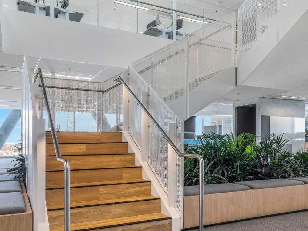 Perforated balustrades transform signature fire stairs at North Sydney ...