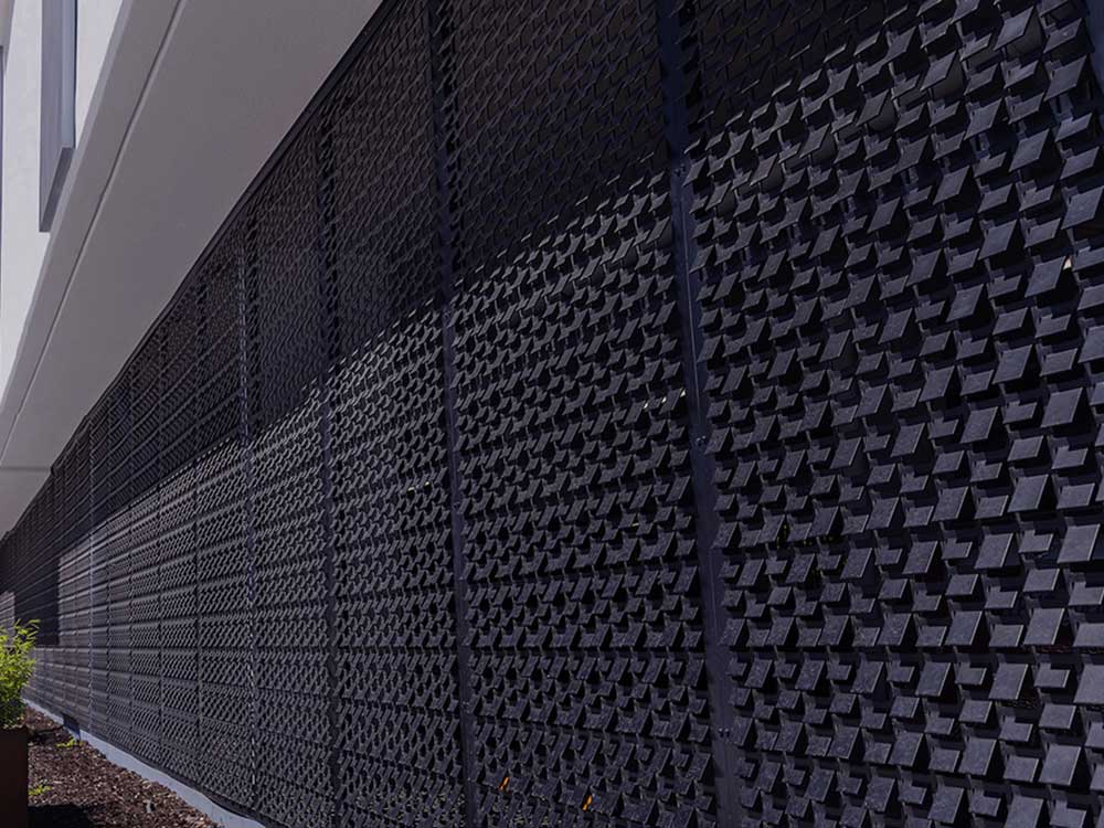 Carpark facade with 3D Strata panels provides privacy and ventilation ...